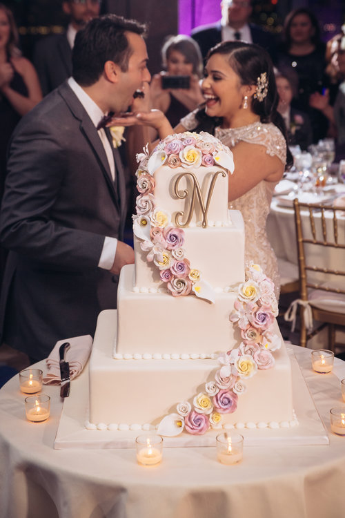 Rosa and Alex Wedding – Bride Feeding Groom Cake – Hyatt Regency Jersey ...